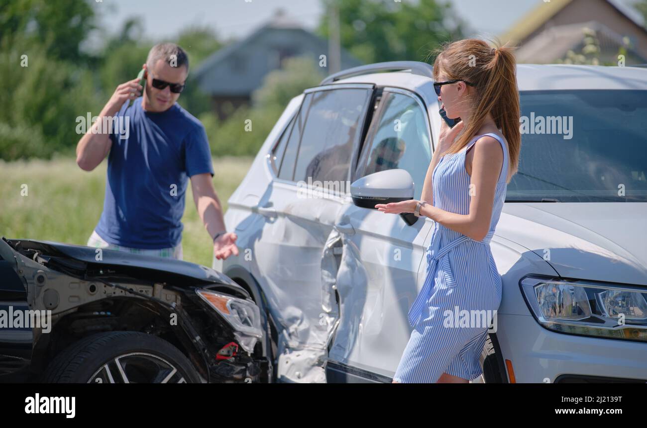Drivers of smashed vehicles talking on cellphone calling for help in ...