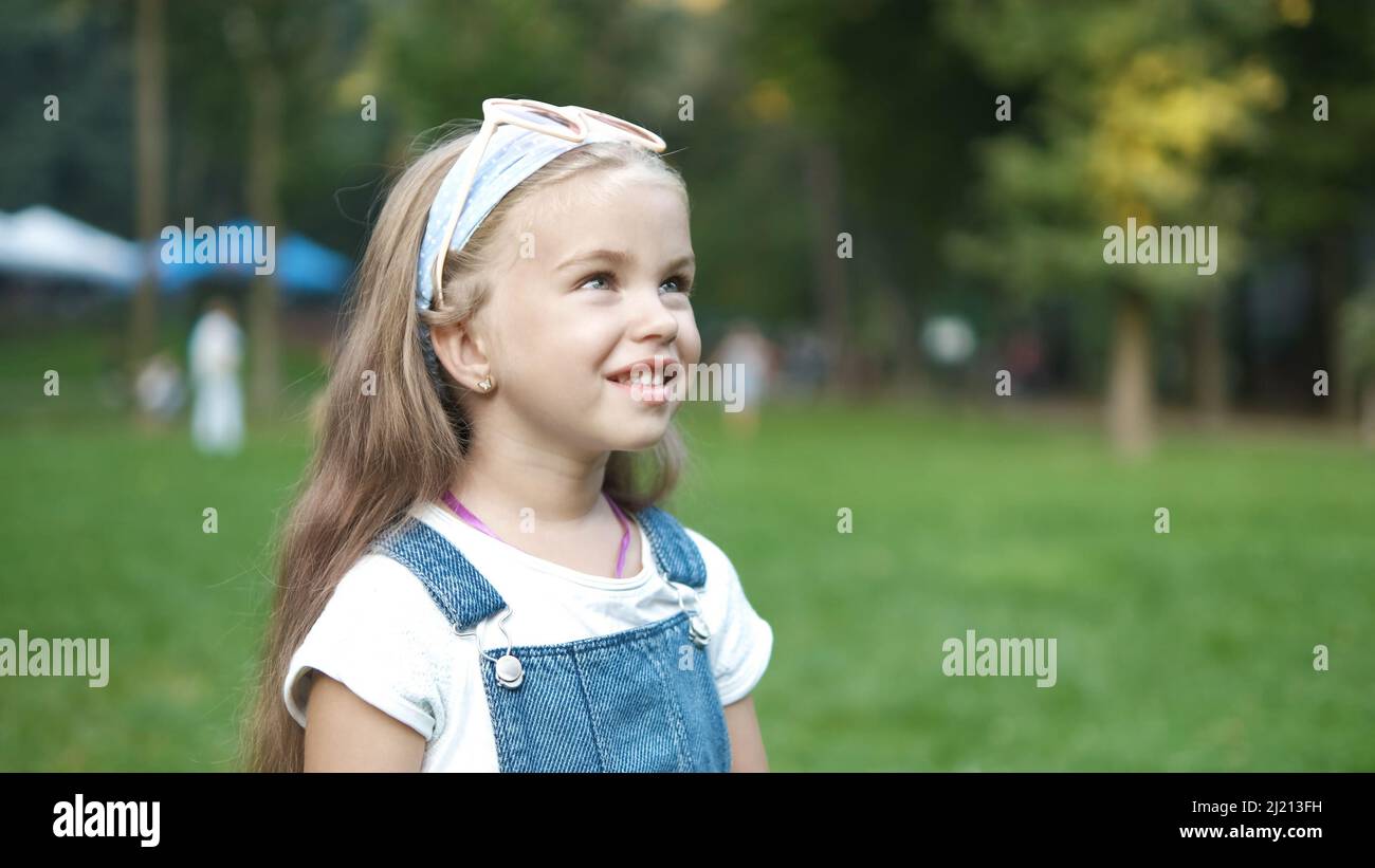 Portrait of happy pretty child girl in summer outdoors Stock Photo - Alamy