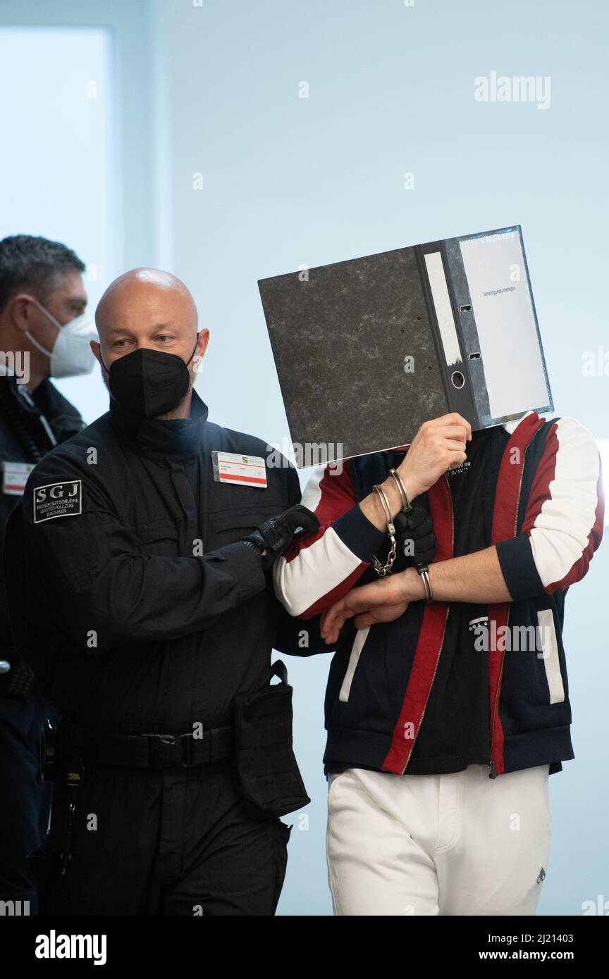 Dresden, Germany. 29th Mar, 2022. A defendant (r) in the Green Vault ...