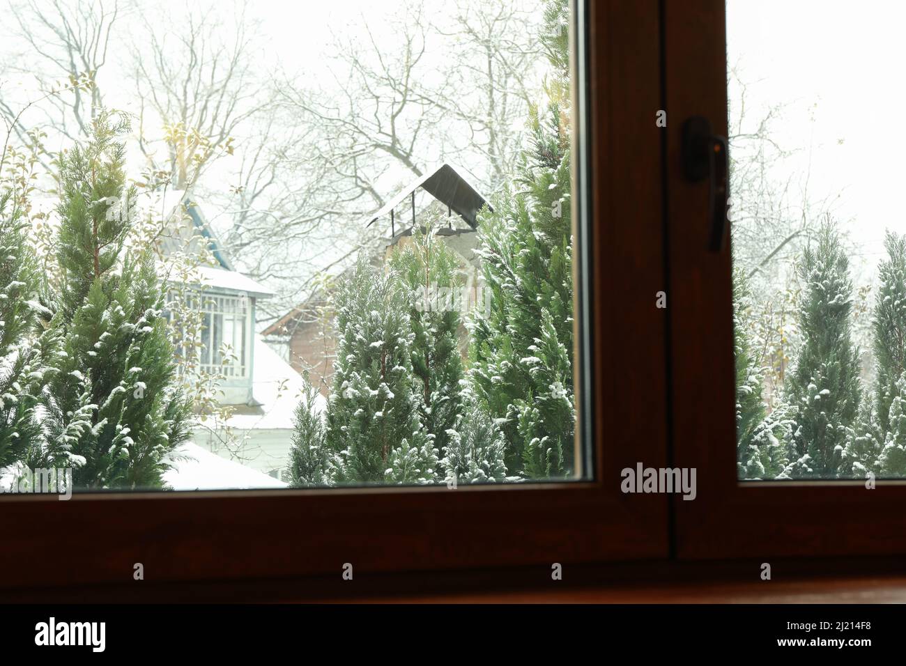 Window of house with view on snowy day Stock Photo - Alamy