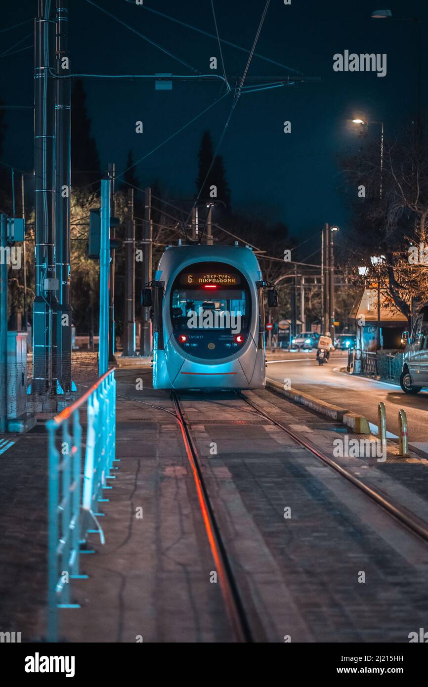 A tram in the city of Athens in Greece at night Stock Photo - Alamy