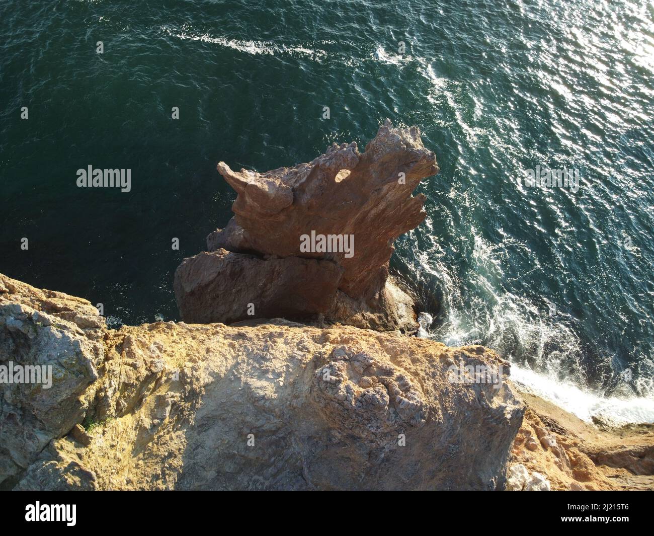 Dragon head arise from the water - The rock or lava formation with the ...