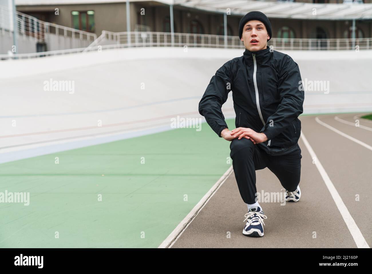 Young man warming up before hi-res stock photography and images - Alamy