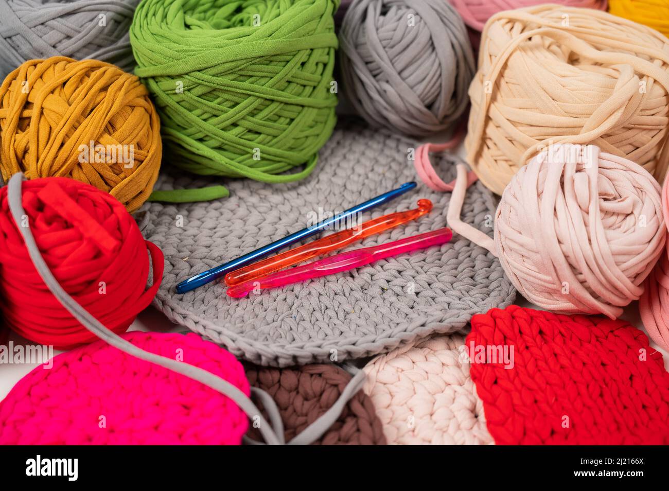 cotton yarn knitting pattern on white table Stock Photo - Alamy