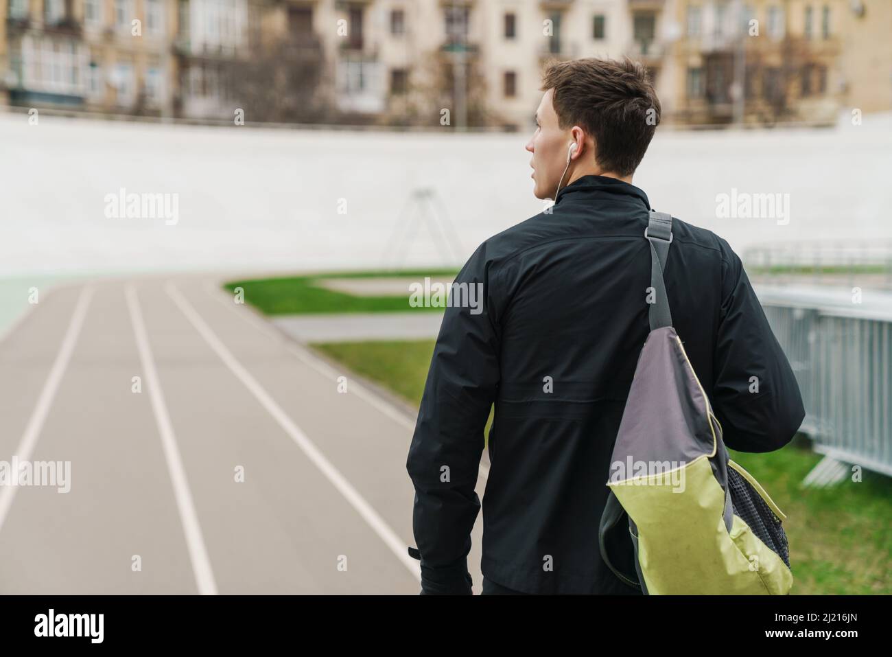 Back view athletic man walking hi-res stock photography and images - Alamy