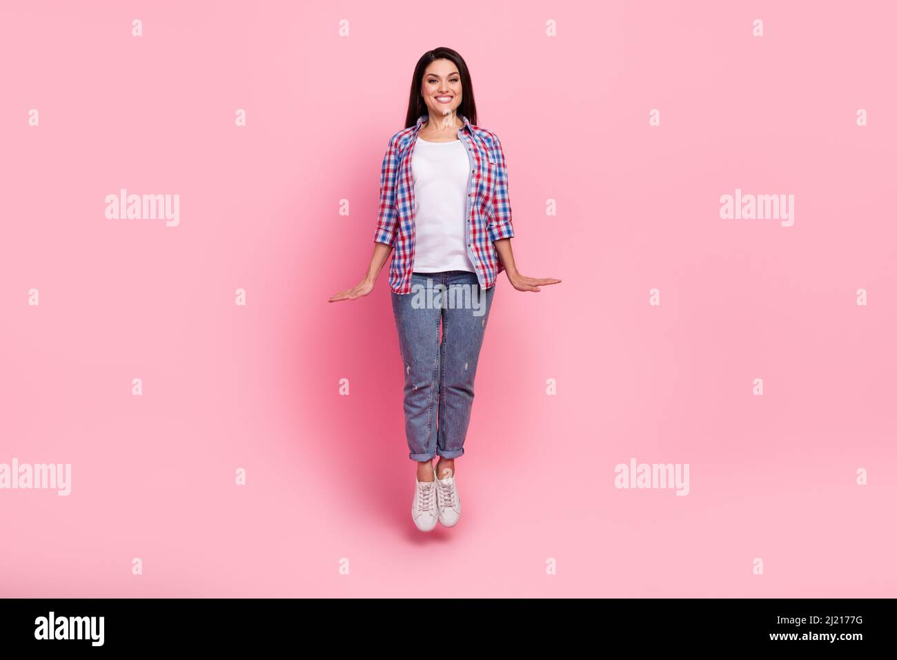 Full boy photo of young brunette lady jump wear shirt jeans footwear ...