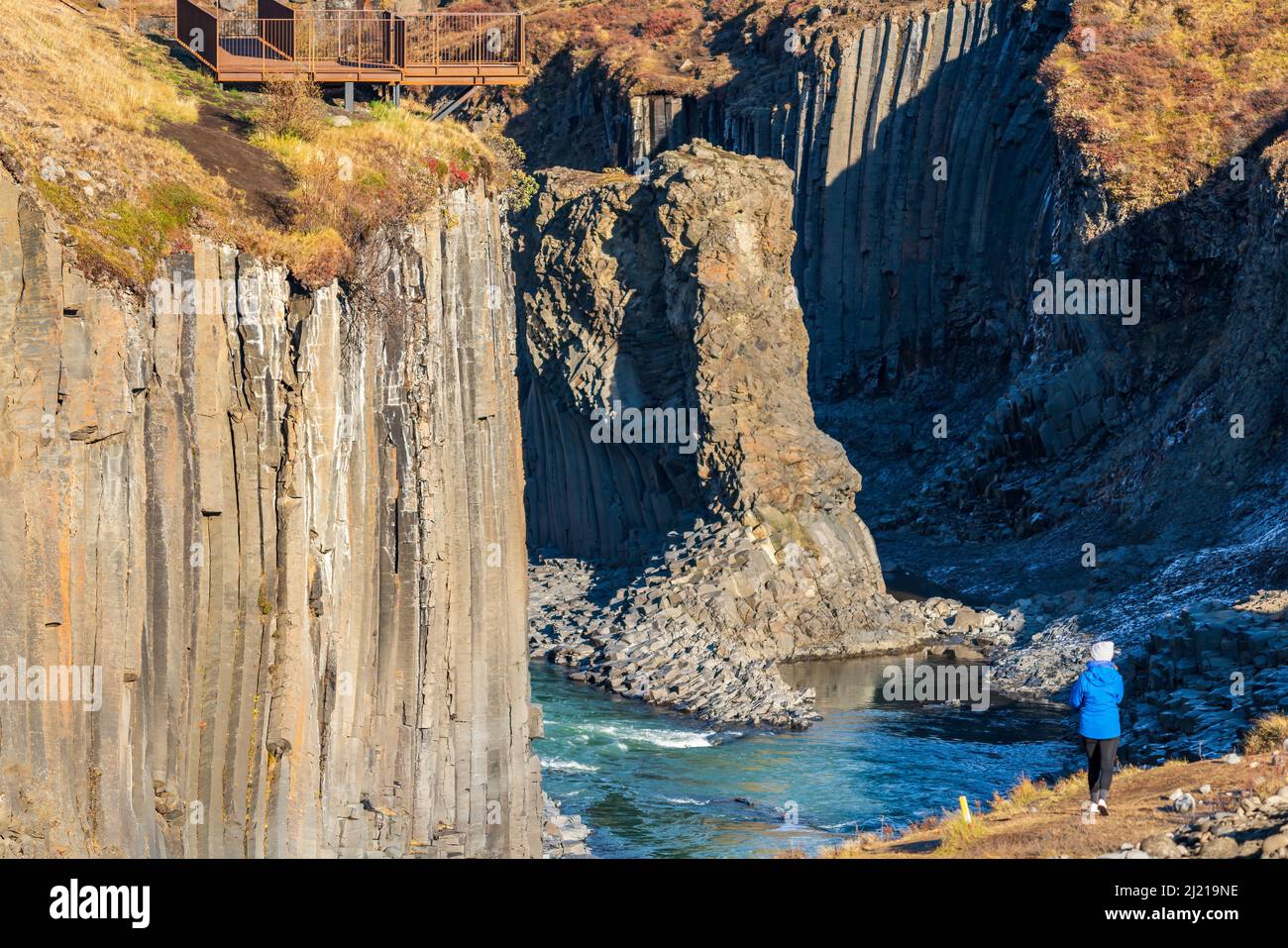 Basaltic columns and river canyon with blurred tourist Stock Photo - Alamy