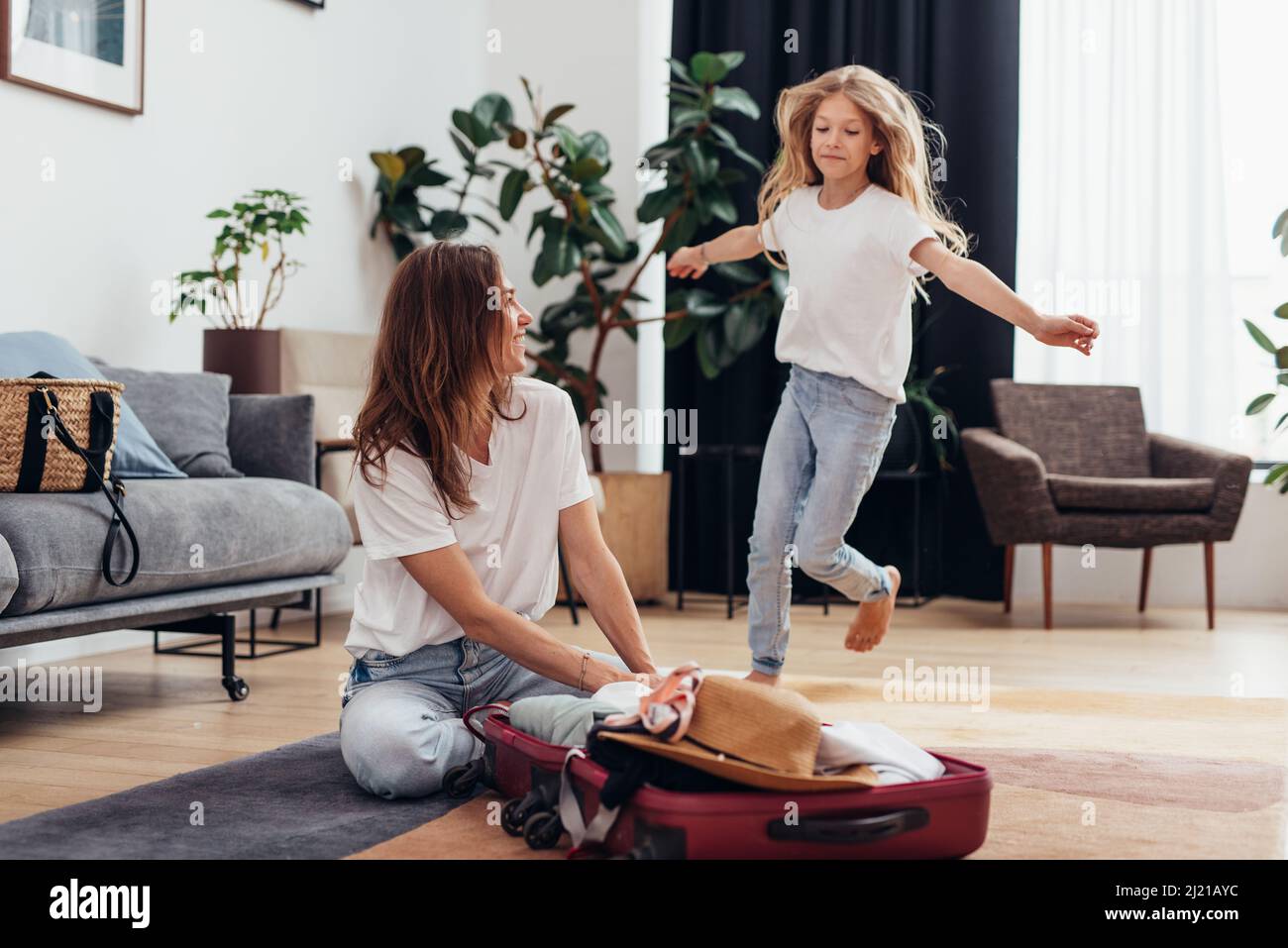 Family packing holiday plane hi-res stock photography and images - Alamy