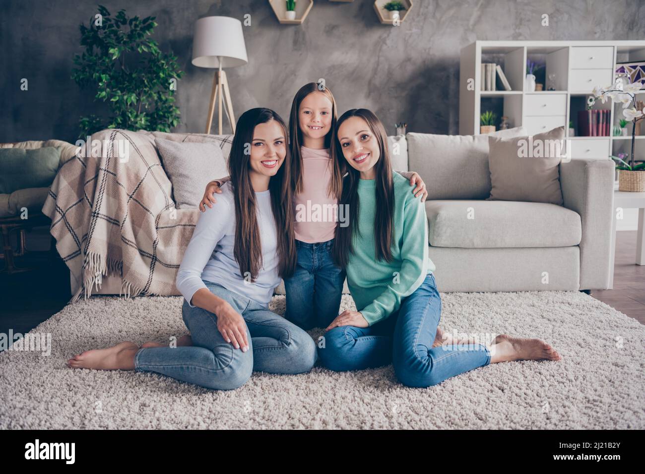 Portrait of attractive sweet cheerful friends family bonding cuddling ...