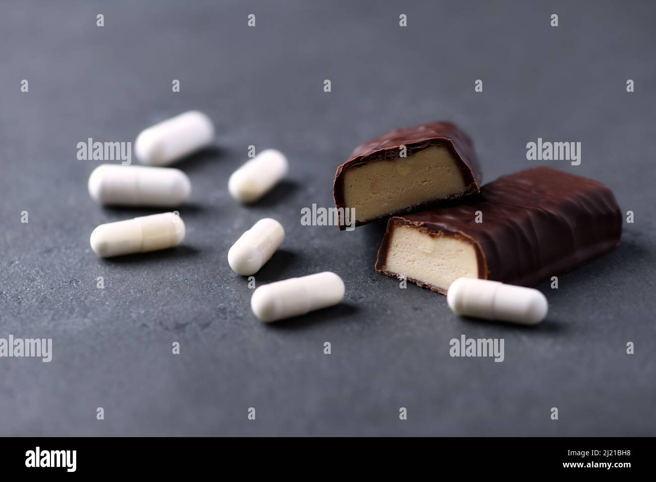 High Protein bar and creatine capsules. Bodybuilding food supplements ...