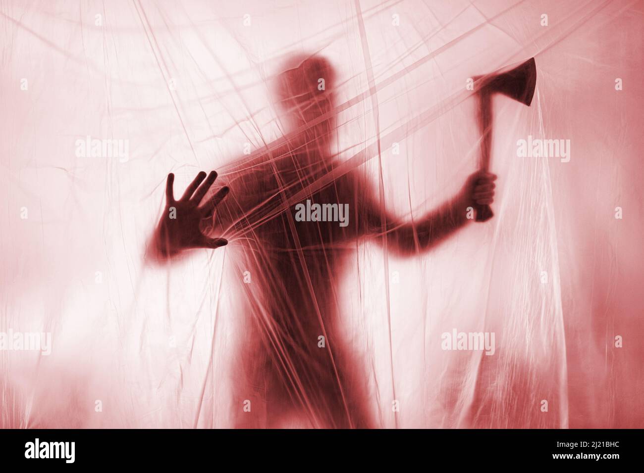 Horror: Fear the Psychopath murder with an axe behind foil Stock Photo ...