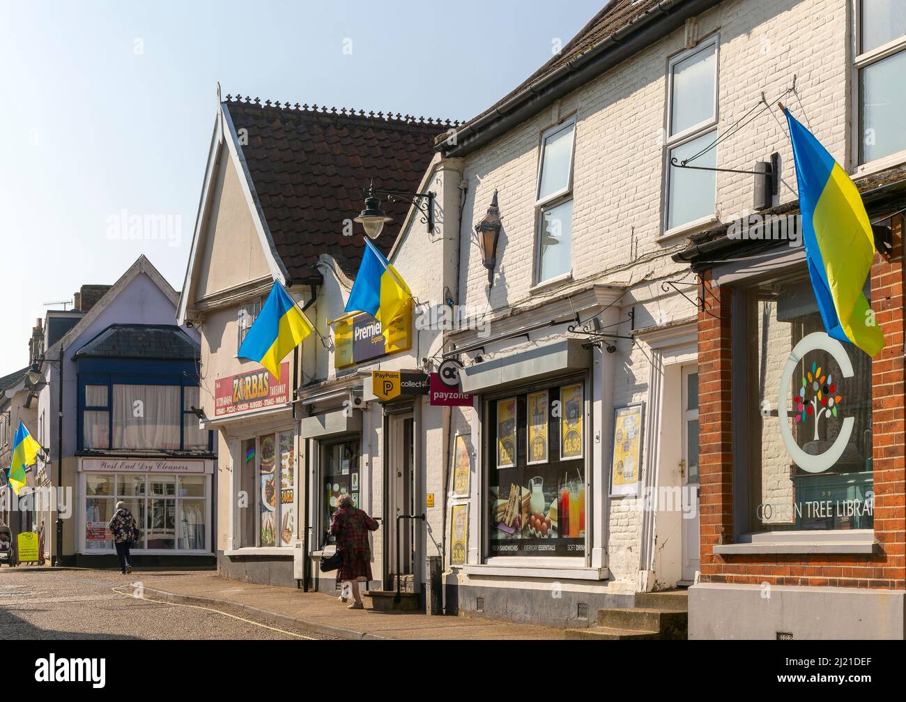 Support for Ukraine, Ukrainian national flags flying outside shops ...