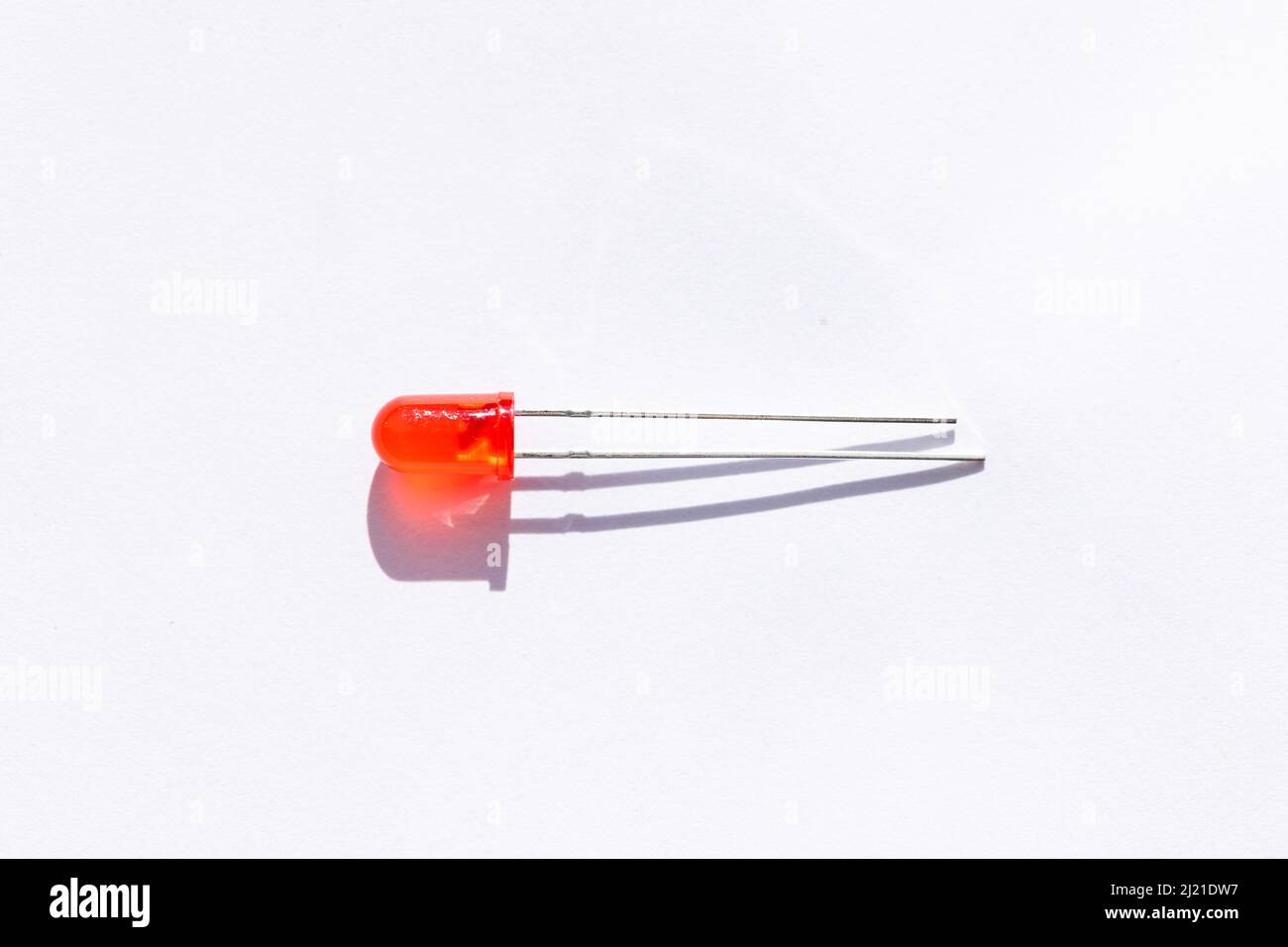 A top down studio portrait of a single red colored LED or color Light ...