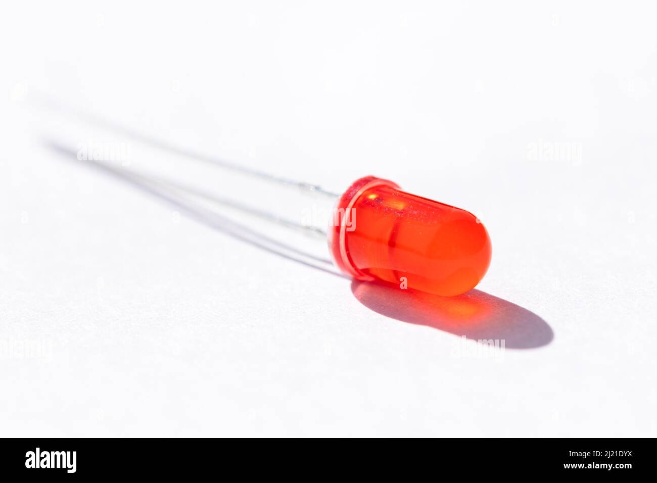 A close up studio portrait of a single red LED or colored Light ...