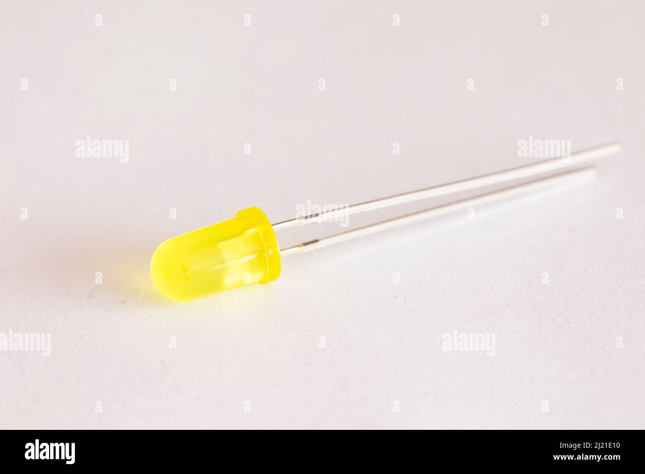 A top down studio portrait of a single yellow colored LED or color ...