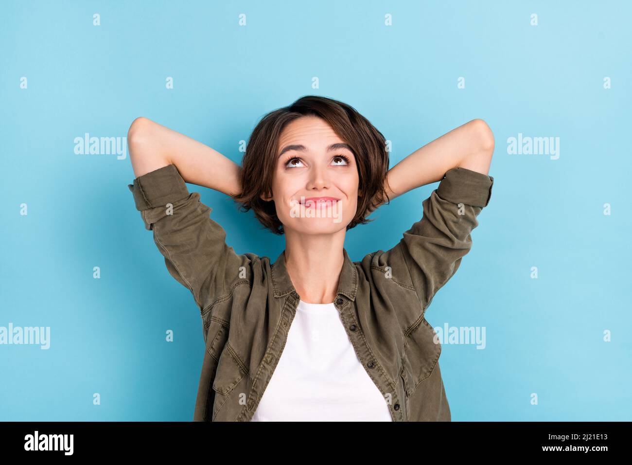 Photo of optimistic young bob hairdo lady hands head look up wear ...