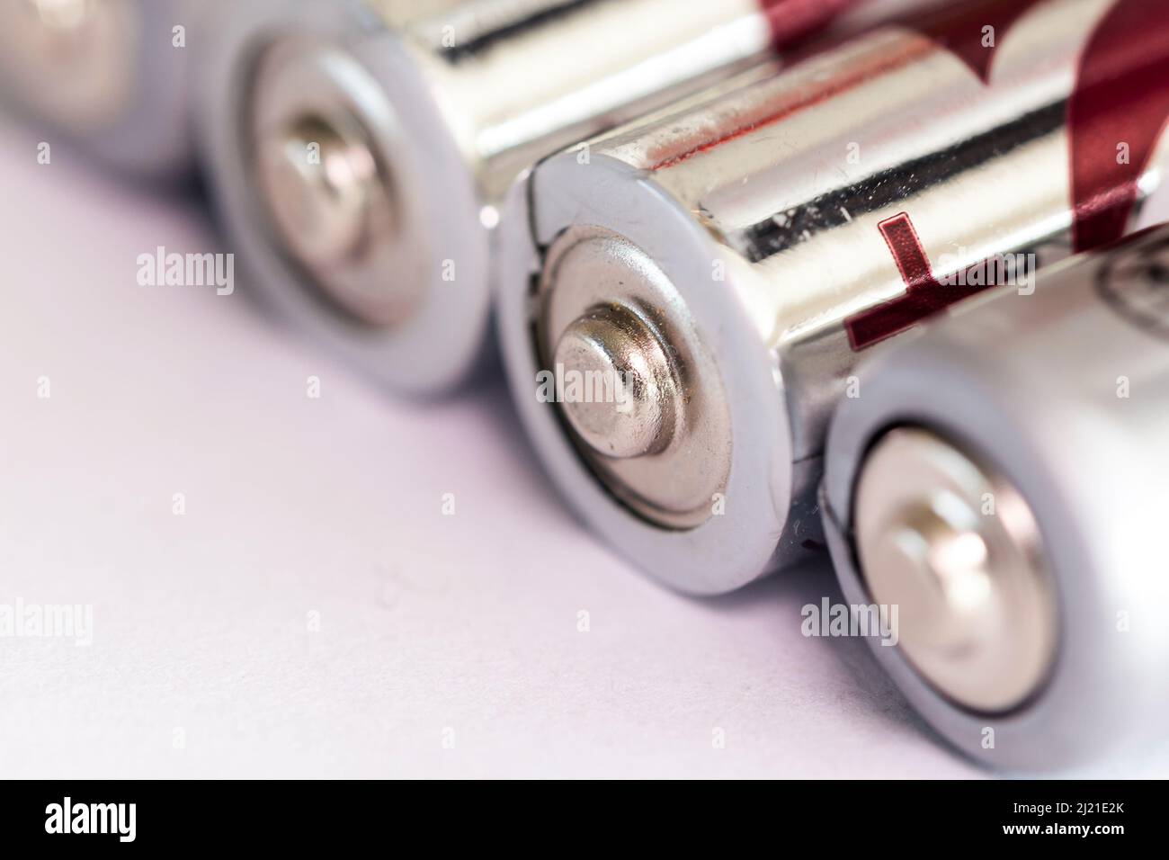 A macro portrait of the plus or positive side of a couple of triple A ...