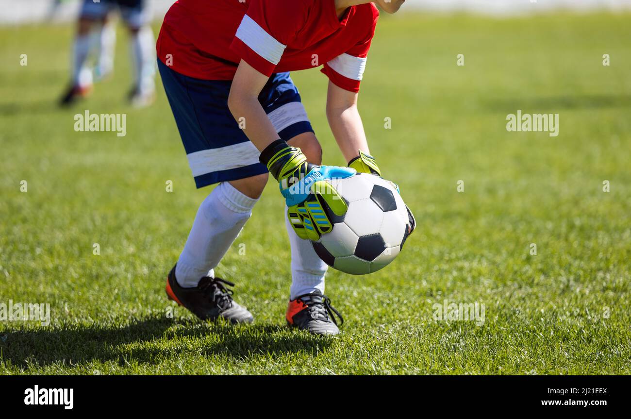 Young Football Goalkeeper Catching Soccer Ball During Tournament Match ...
