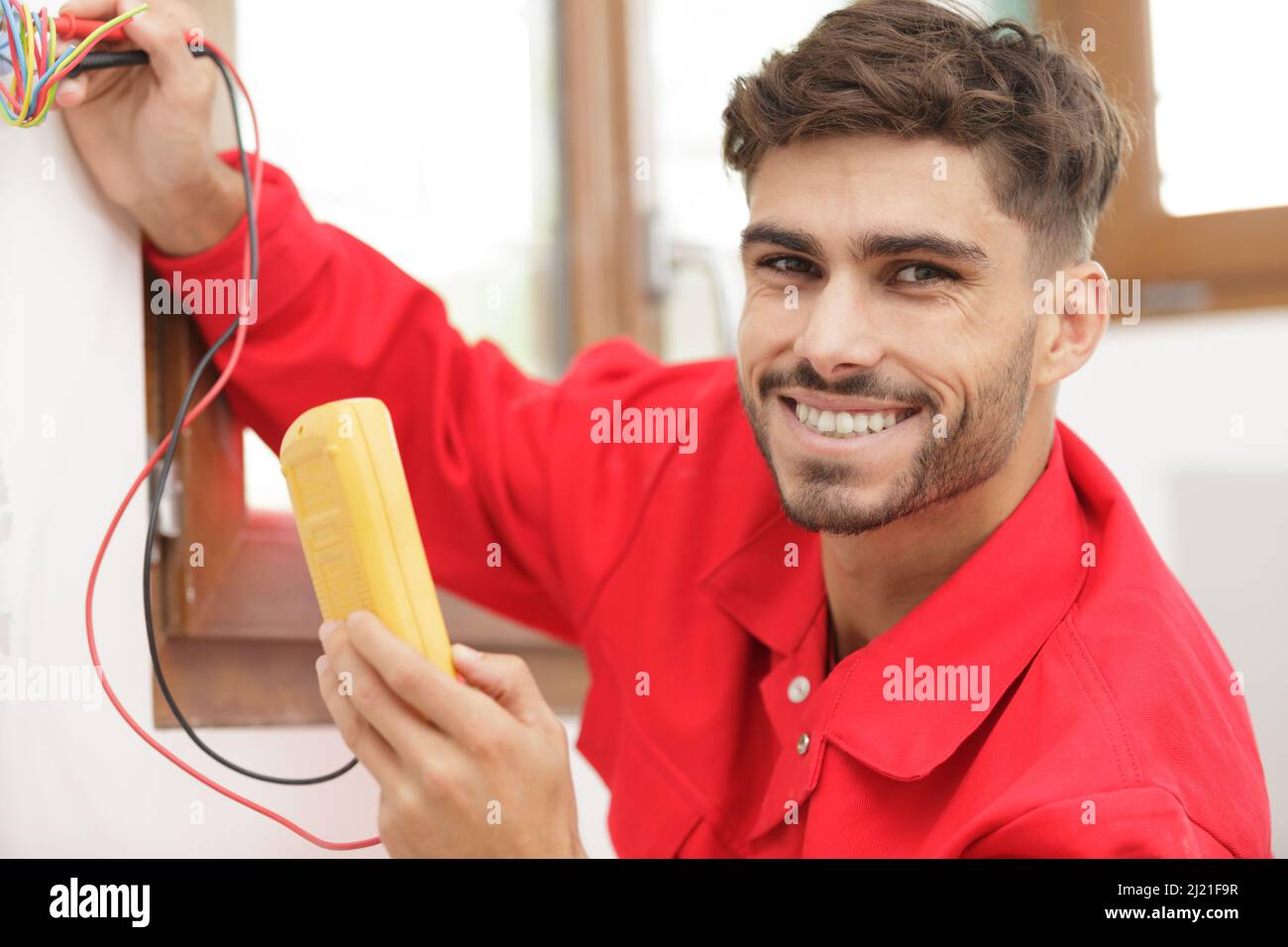 electrician measuring voltage of socket Stock Photo - Alamy