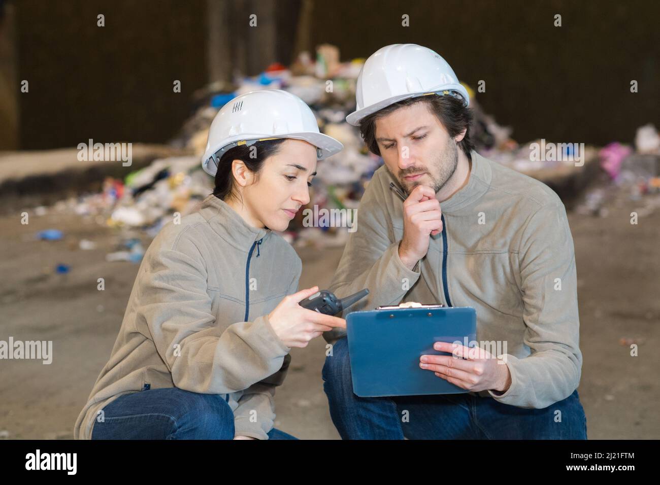 sanitation workers working in recycling plant Stock Photo - Alamy