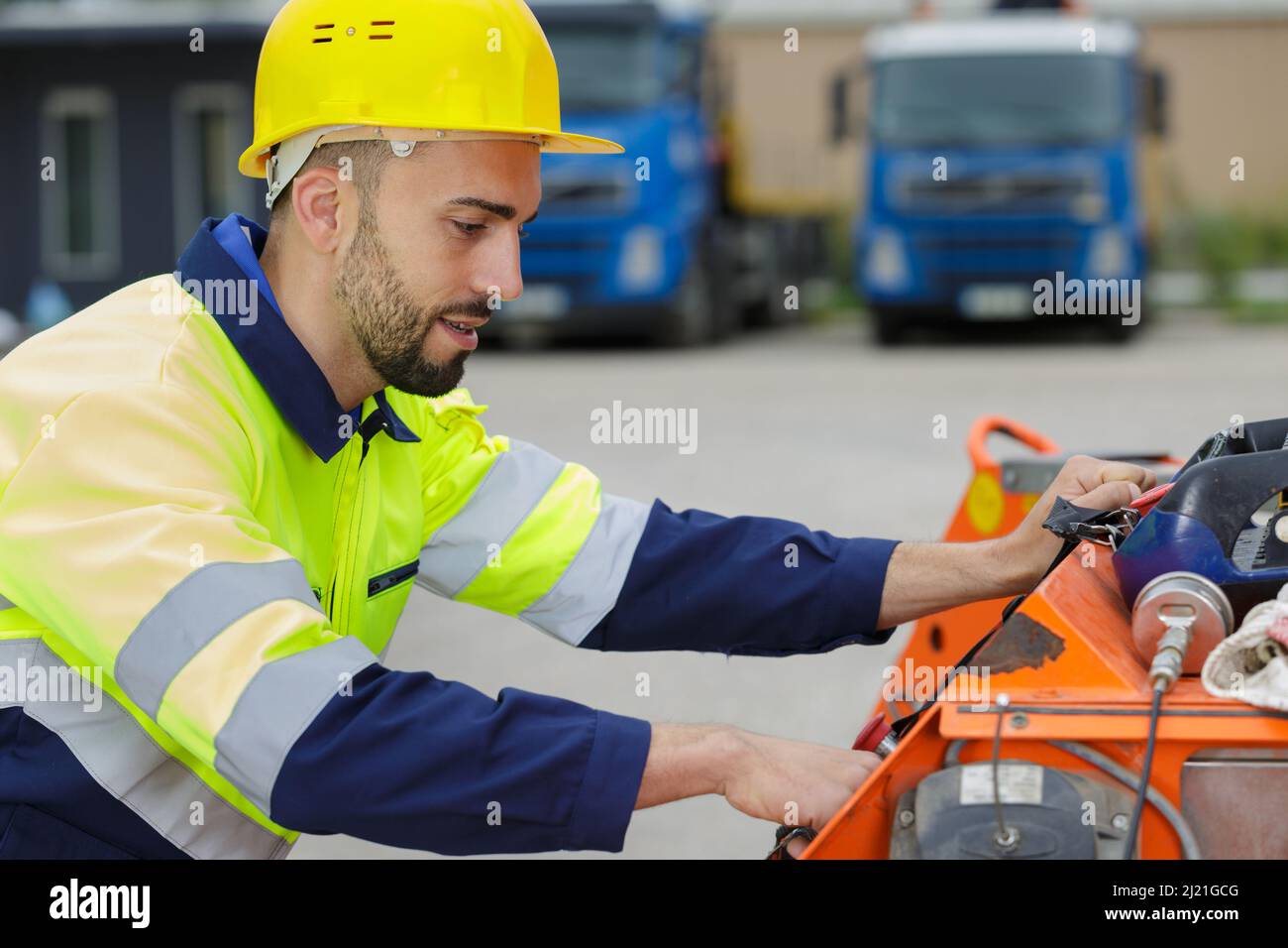 industrial worker outdoors operating machinery Stock Photo - Alamy