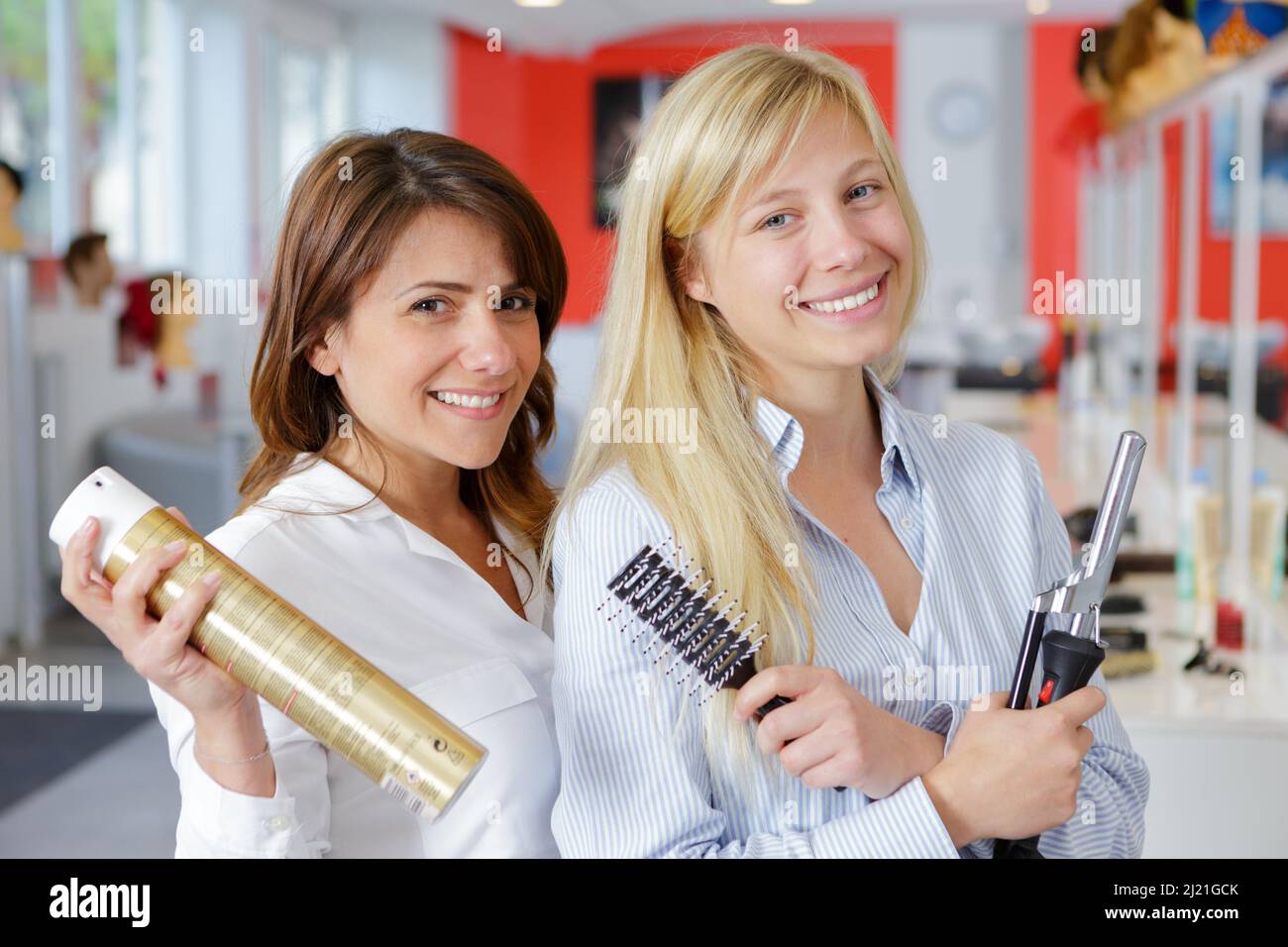 female hairdresser at the salon holding hairdressing tools Stock Photo ...