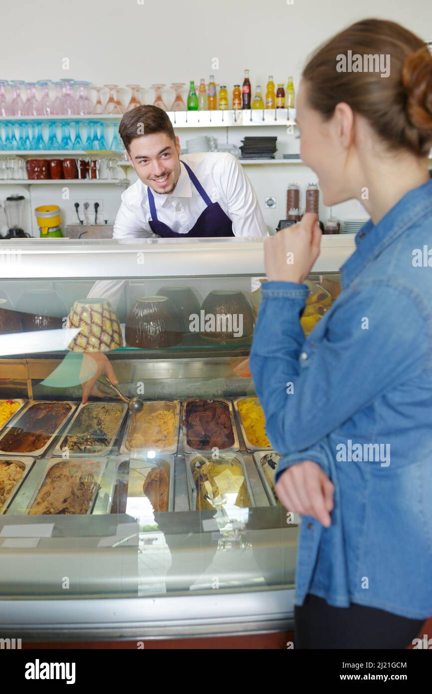 serving female customer Stock Photo - Alamy