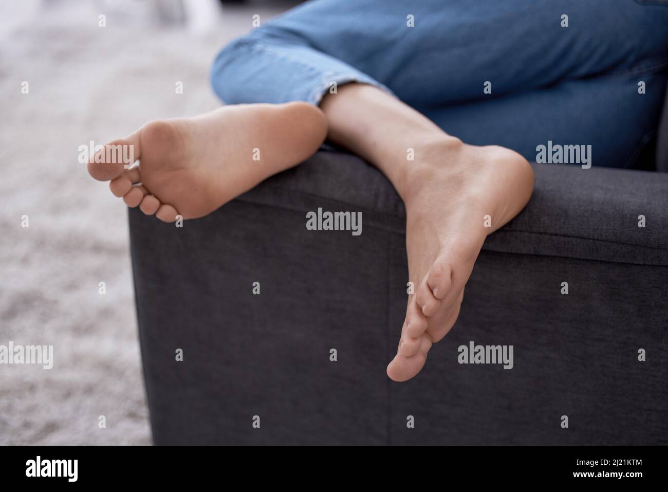 Barefoot woman resting feet on hi-res stock photography and images - Alamy