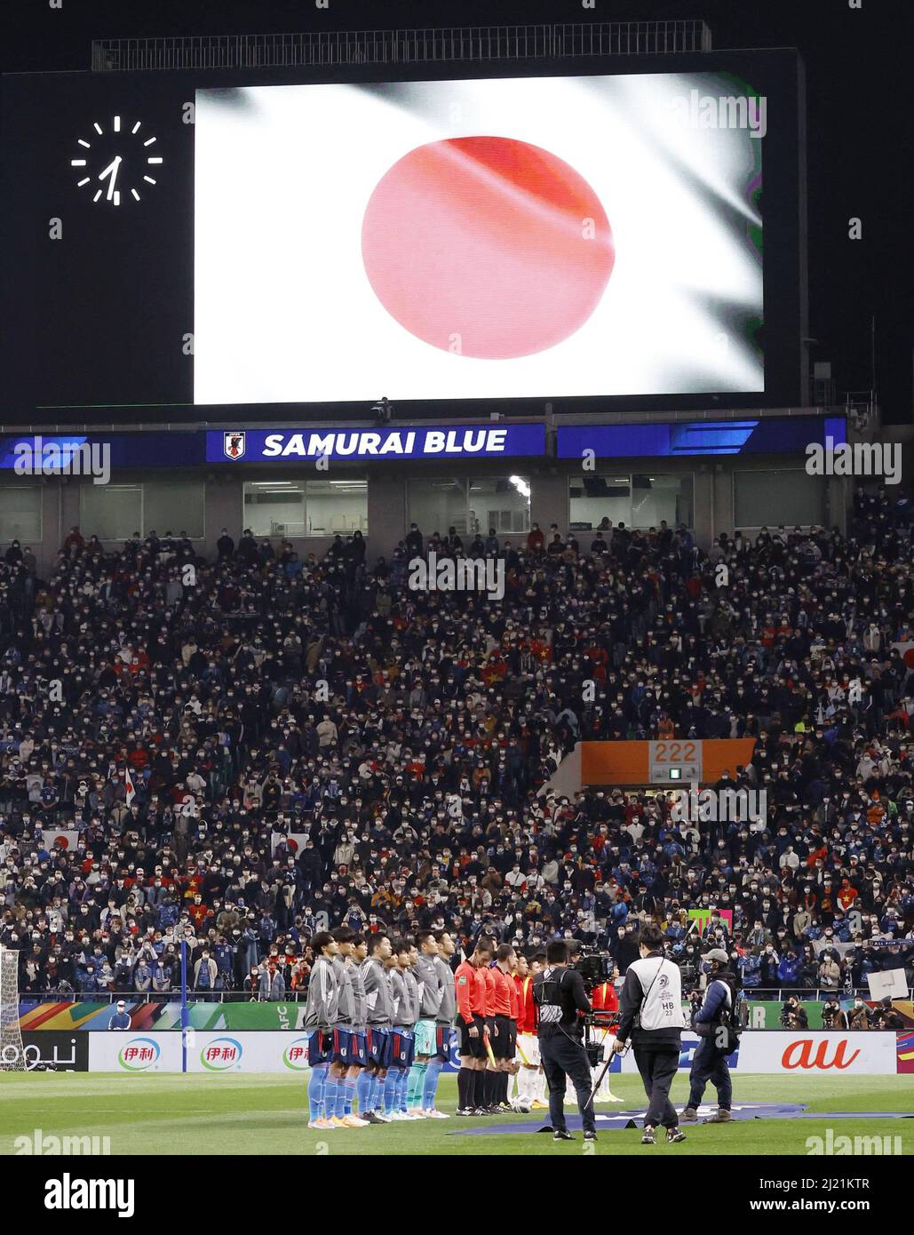 Members of the Japanese men's national soccer team are lined up ahead ...