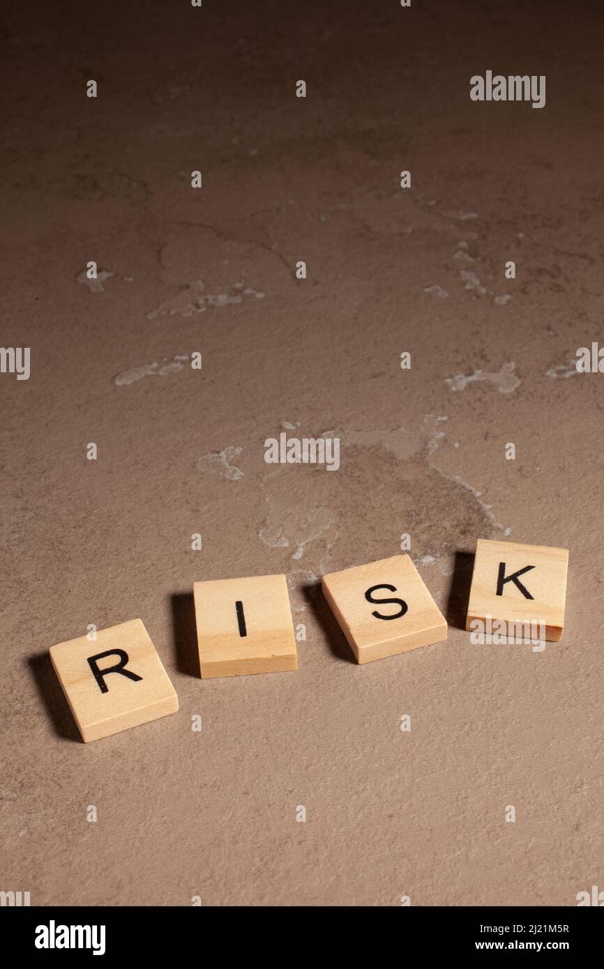 Risk Word on Wooden Tile Block Stock Photo - Alamy