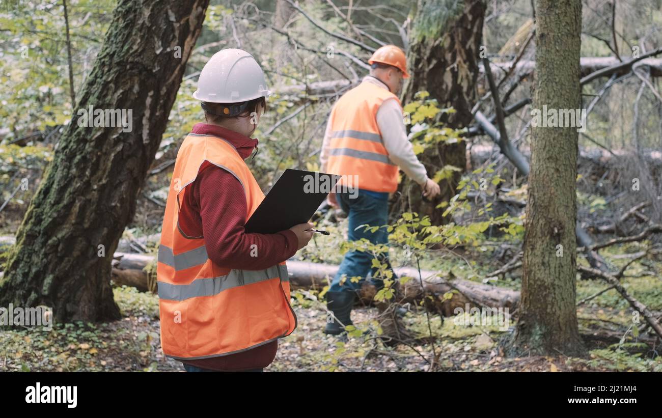 Environmentalists a woman and man draw up a penalty protocol for ...