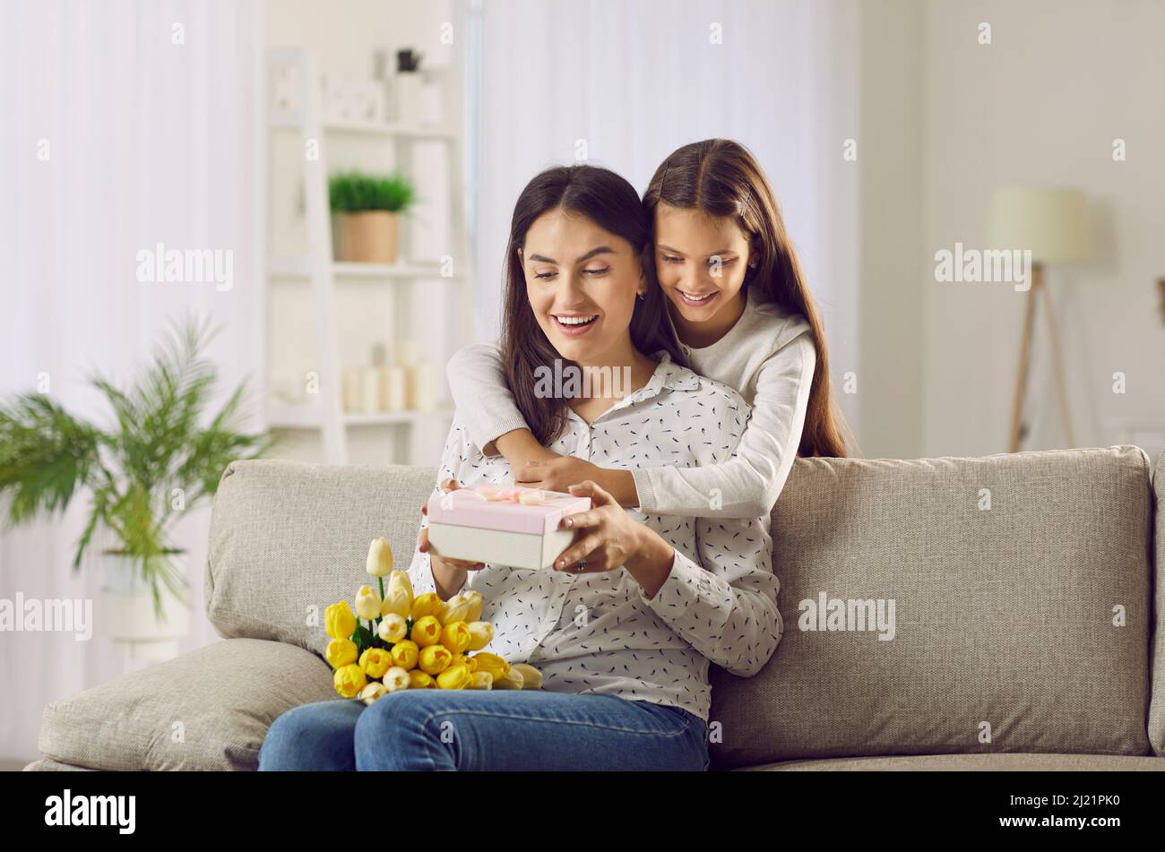 Mom getting gift from child hi-res stock photography and images - Alamy