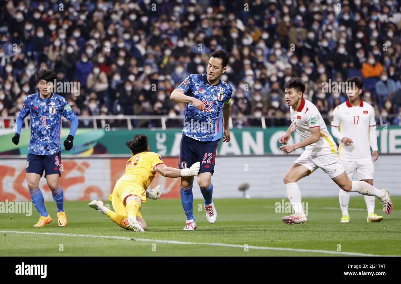 Maya Yoshida (C) of Japan scores during the second half of a Group B ...