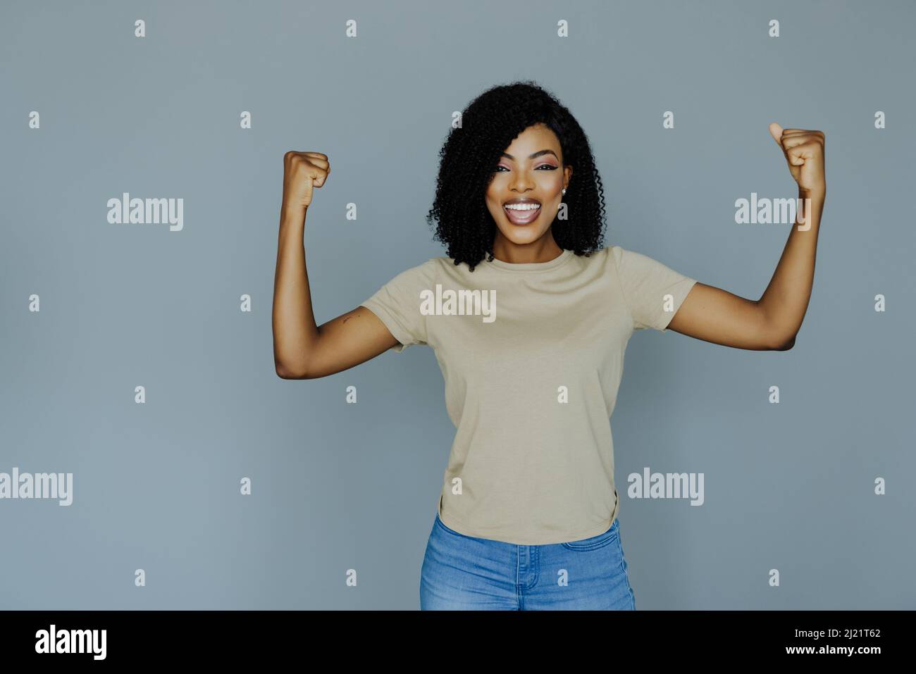 African woman winner celebrating win victory success raising hands ...