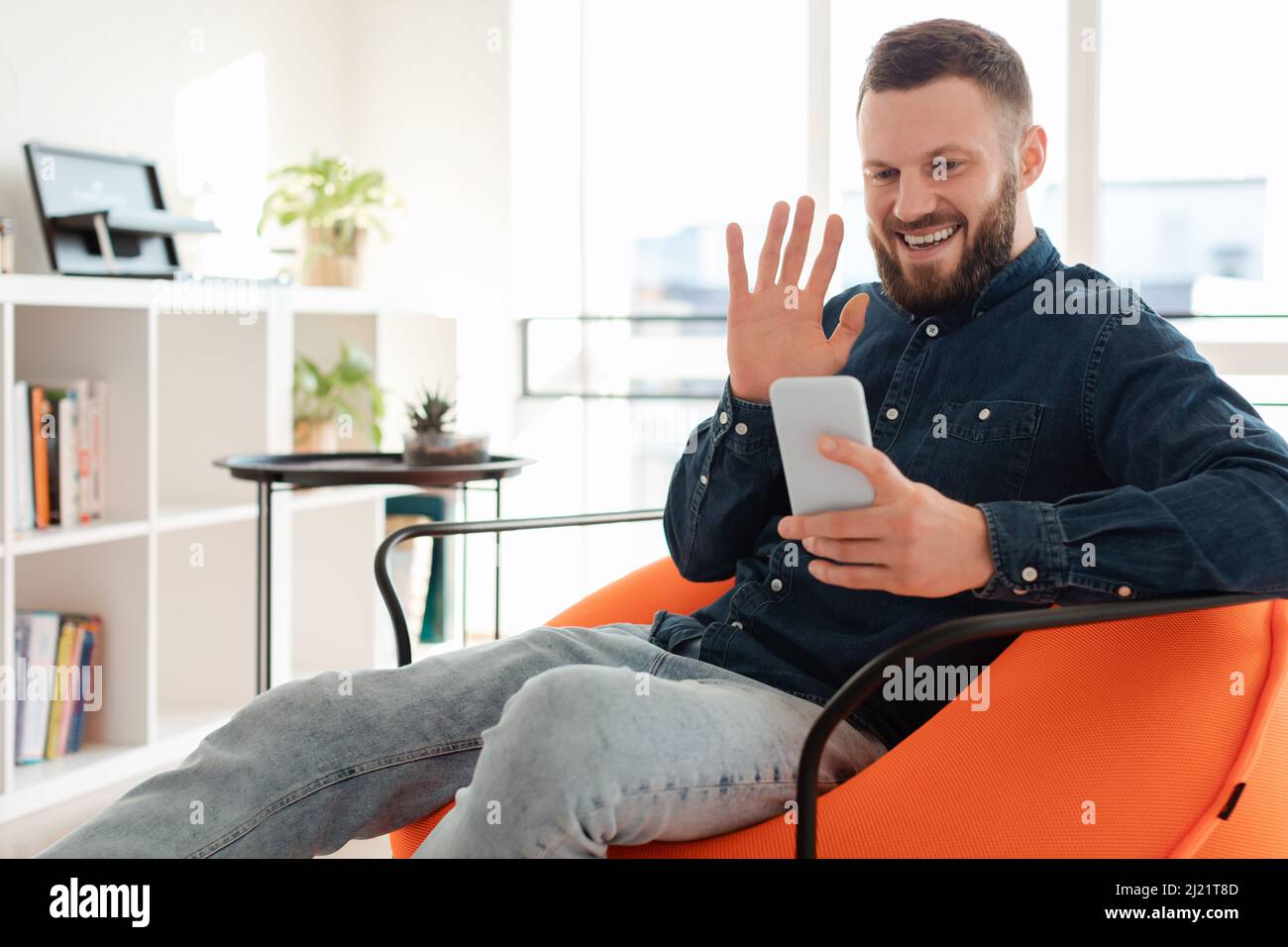 Happy Male Making Video Call Waving Hello To Phone Indoor Stock Photo ...