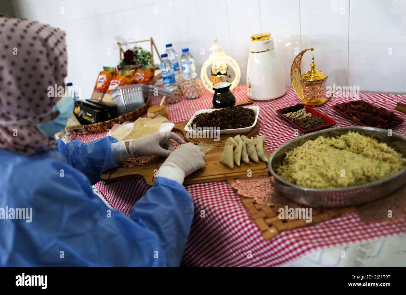 Gaza, Palestine. 29th Mar, 2022. A Palestinian woman prepares food for ...