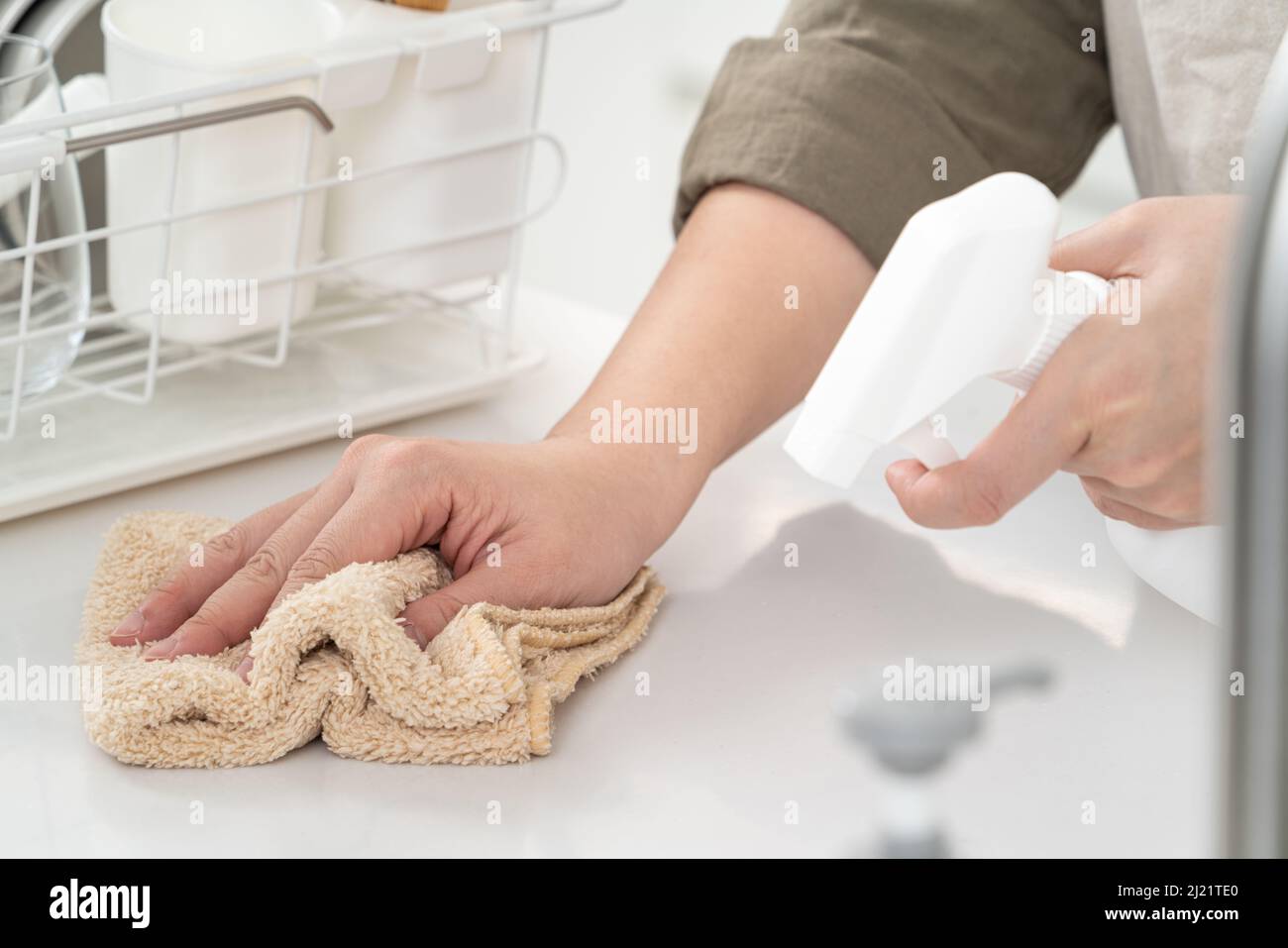 Woman housewife is doing the spring cleaning at home kitchen with using ...