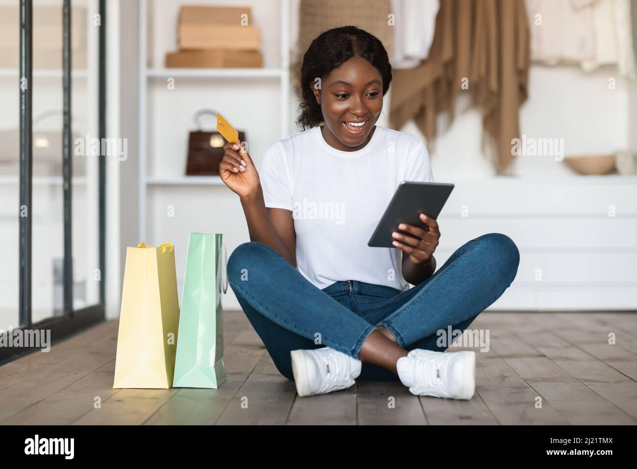 African Lady Shopping Using Tablet And Credit Card At Home Stock Photo ...