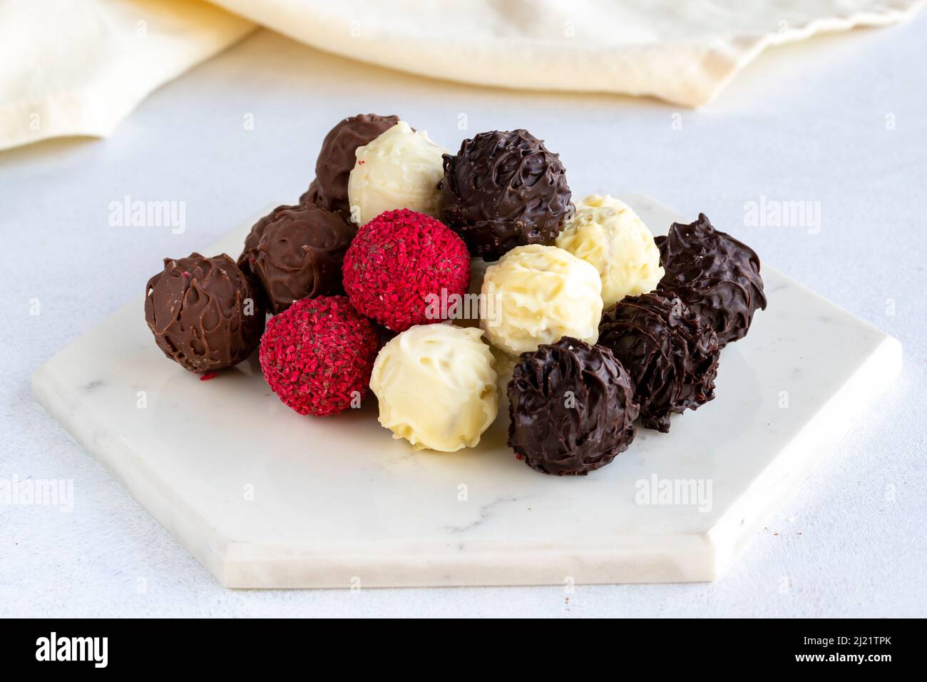 Truffle chocolate assortment on a white background. homemade chocolate ...