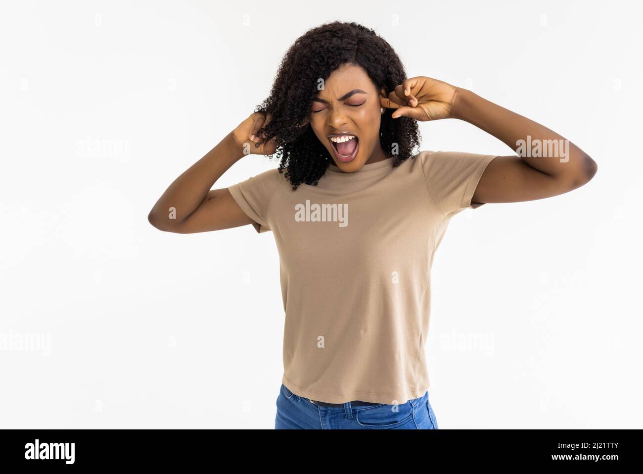Very happy woman screaming over a white background Stock Photo - Alamy