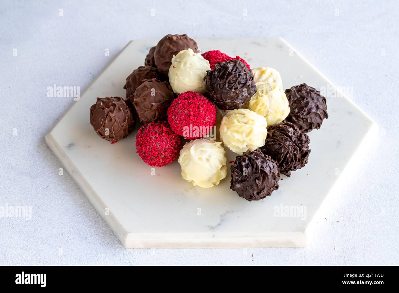 Truffle chocolate assortment on a white background. homemade chocolate ...