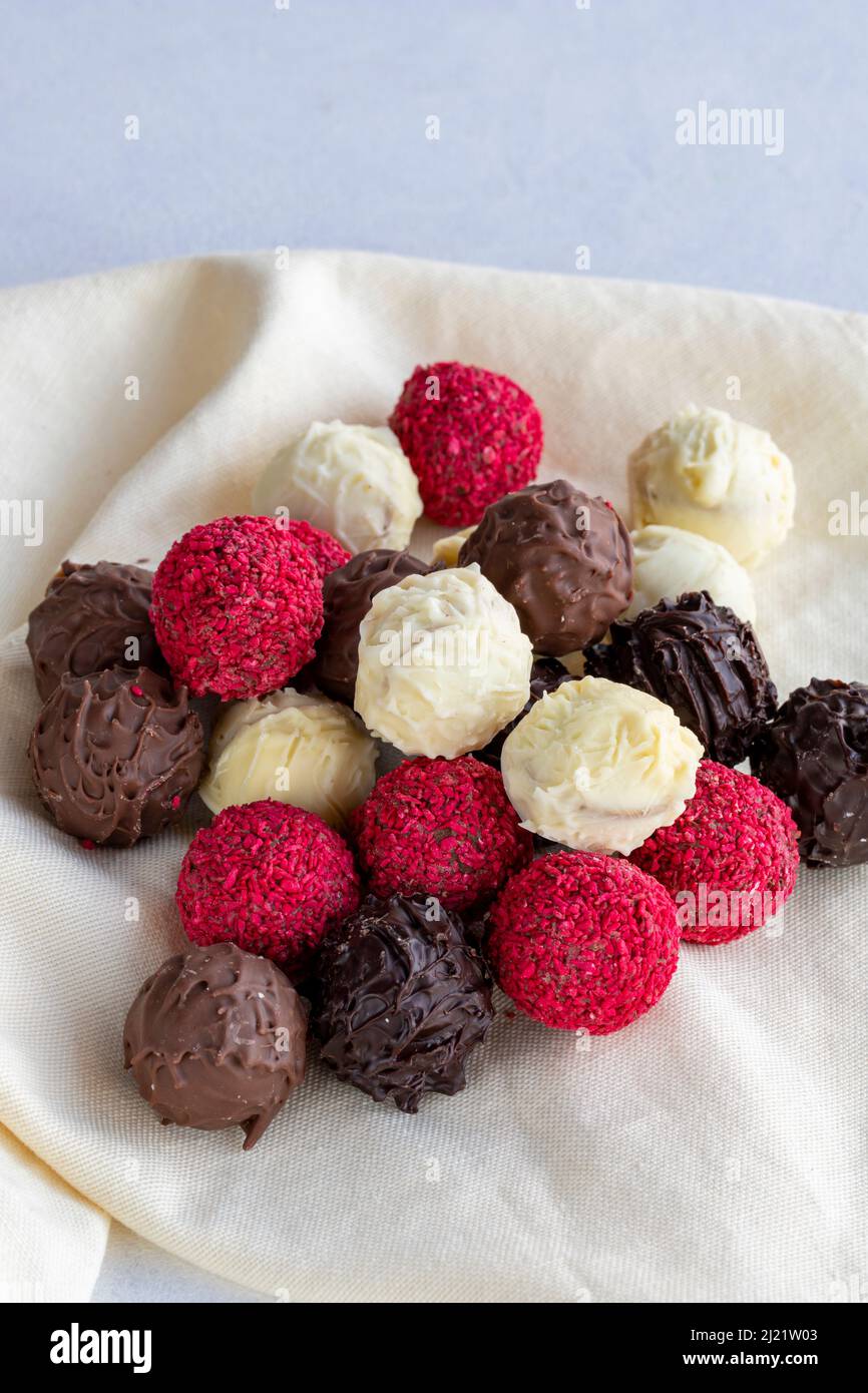 Truffle chocolate assortment on a white background. homemade chocolate ...