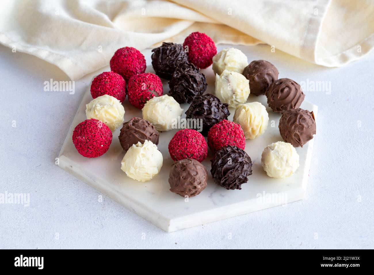 Truffle chocolate assortment on a white background. homemade chocolate ...