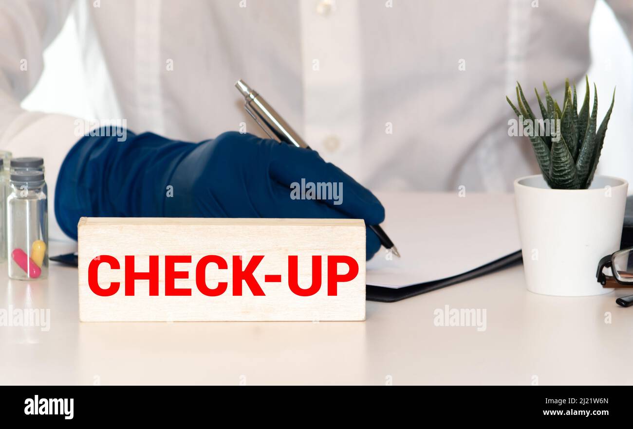 Check-up - Doctor with chalkboard on white background Stock Photo - Alamy
