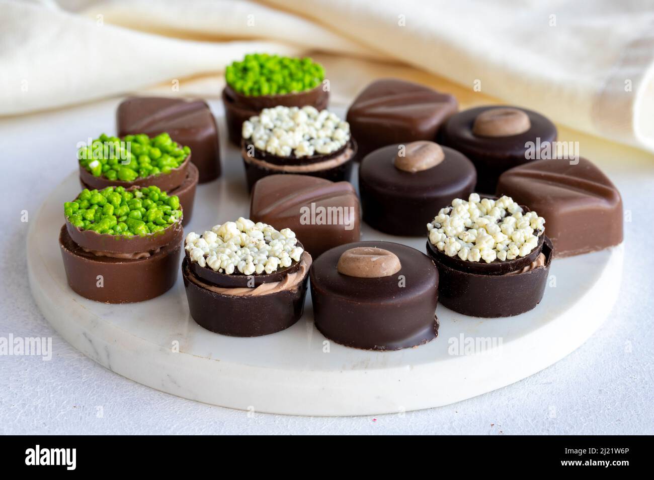 Assorted chocolates on a white background. assorted chocolate pralines ...