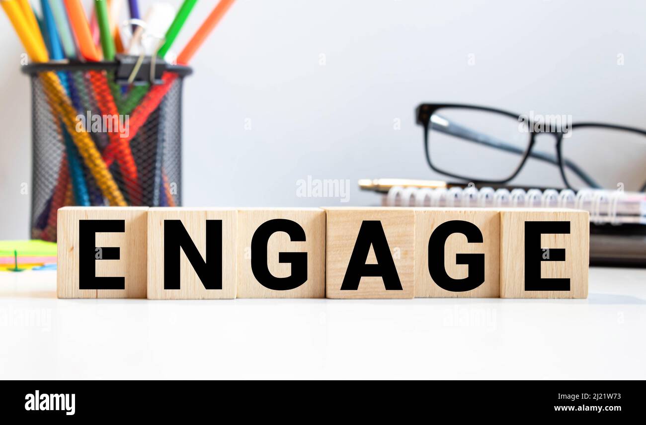 ENGAGE word made with building blocks, concept Stock Photo - Alamy