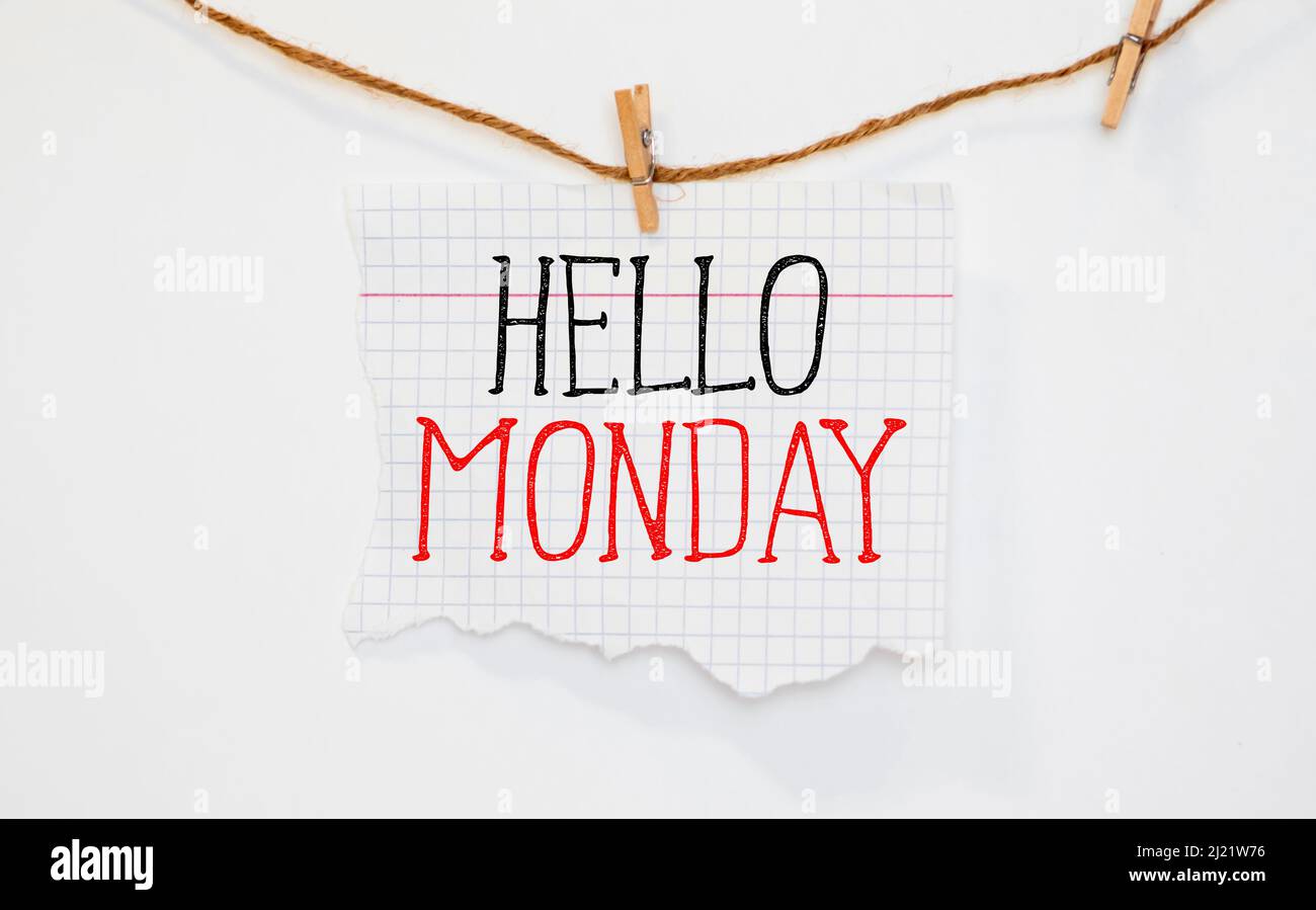 hello Monday text on a note on rustic wooden table Stock Photo - Alamy