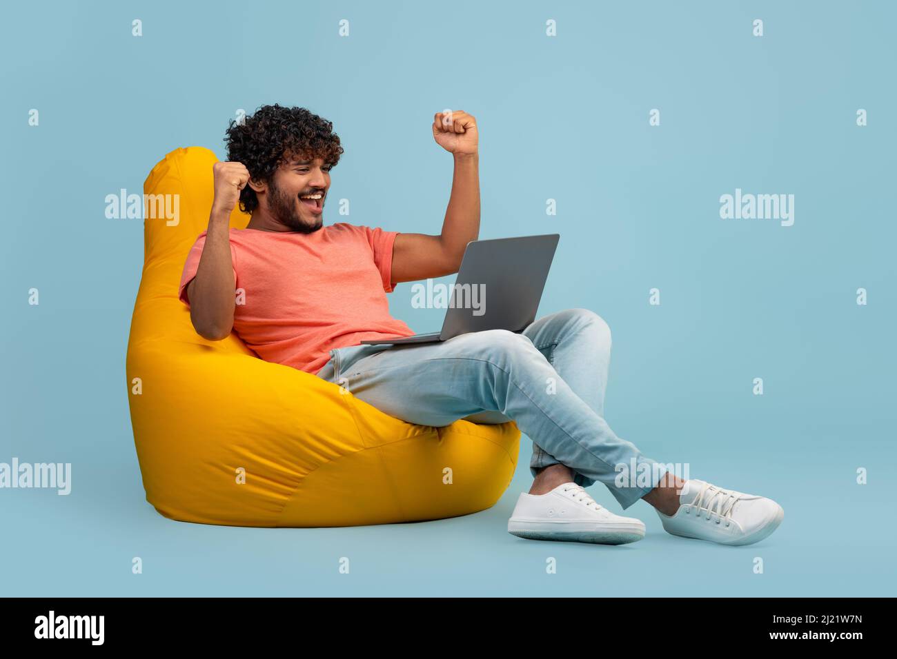 Excited hindu guy using hi-res stock photography and images - Alamy