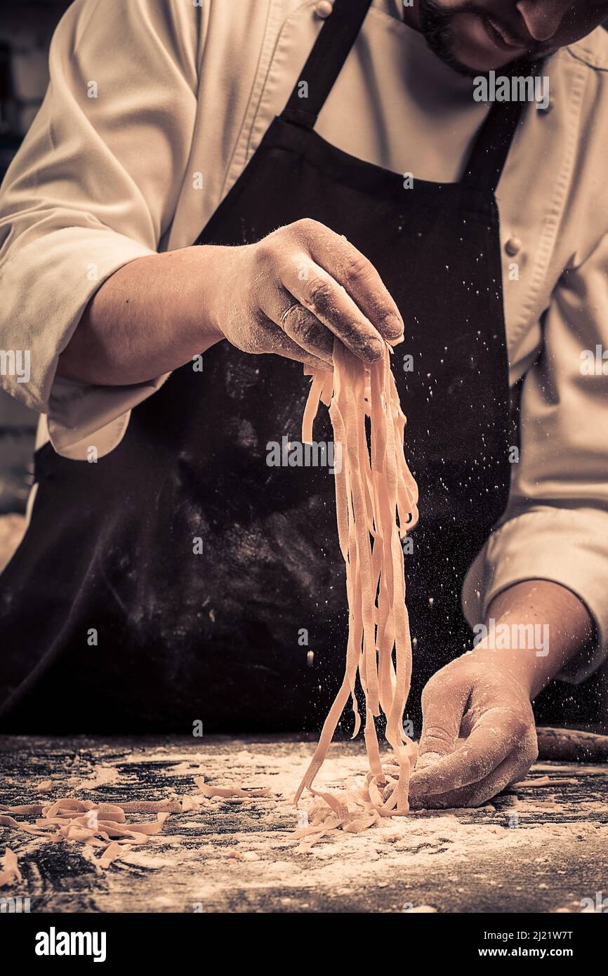 The chef makes fresh spaghetti from scratch Stock Photo - Alamy