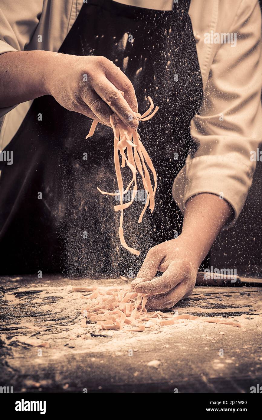 The chef makes fresh spaghetti from scratch Stock Photo - Alamy